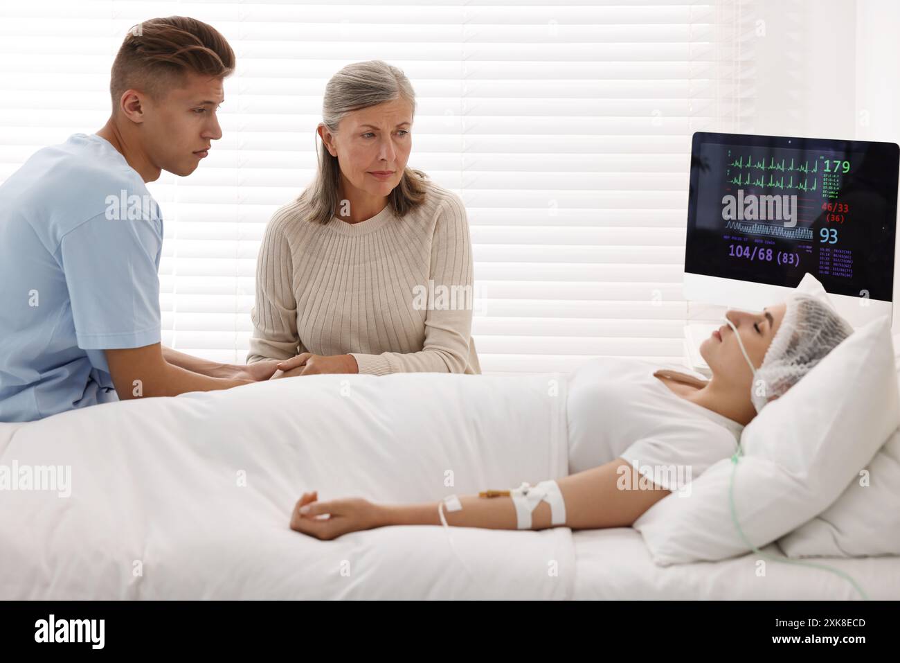 Male patient hospital bed relatives hi-res stock photography and images ...