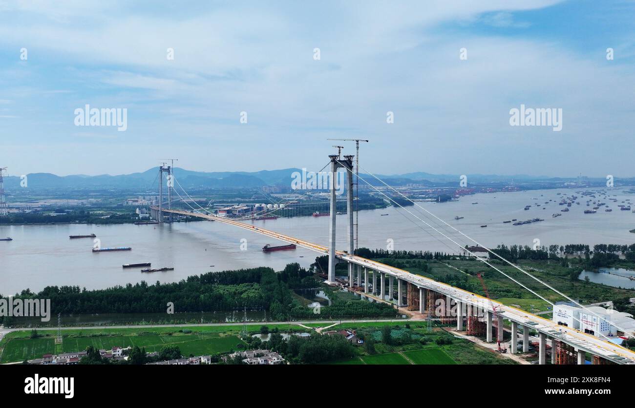 Aerial photo shows the Longtan Yangtze River Bridge under construction ...