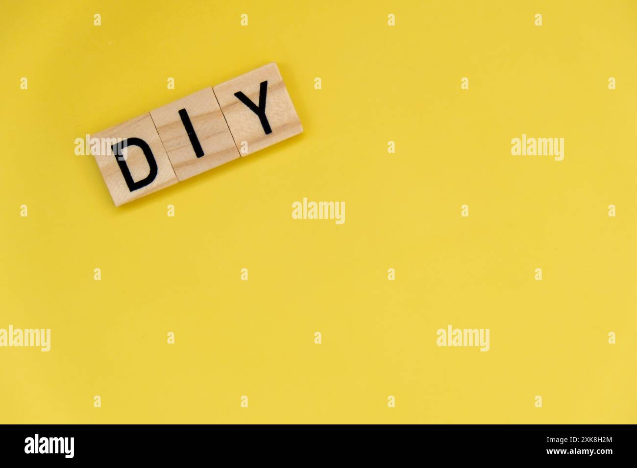 DIY Do It Yourself inscription on yellow background. Handmade home ...