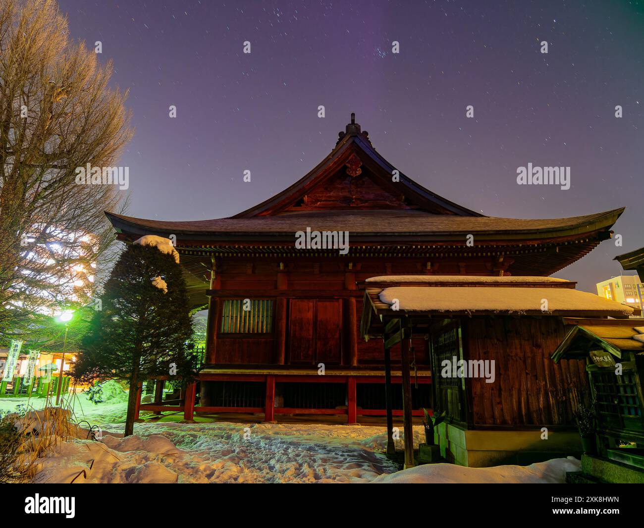 Night exterior view of a Japanese temple with starry sky at Takayama ...