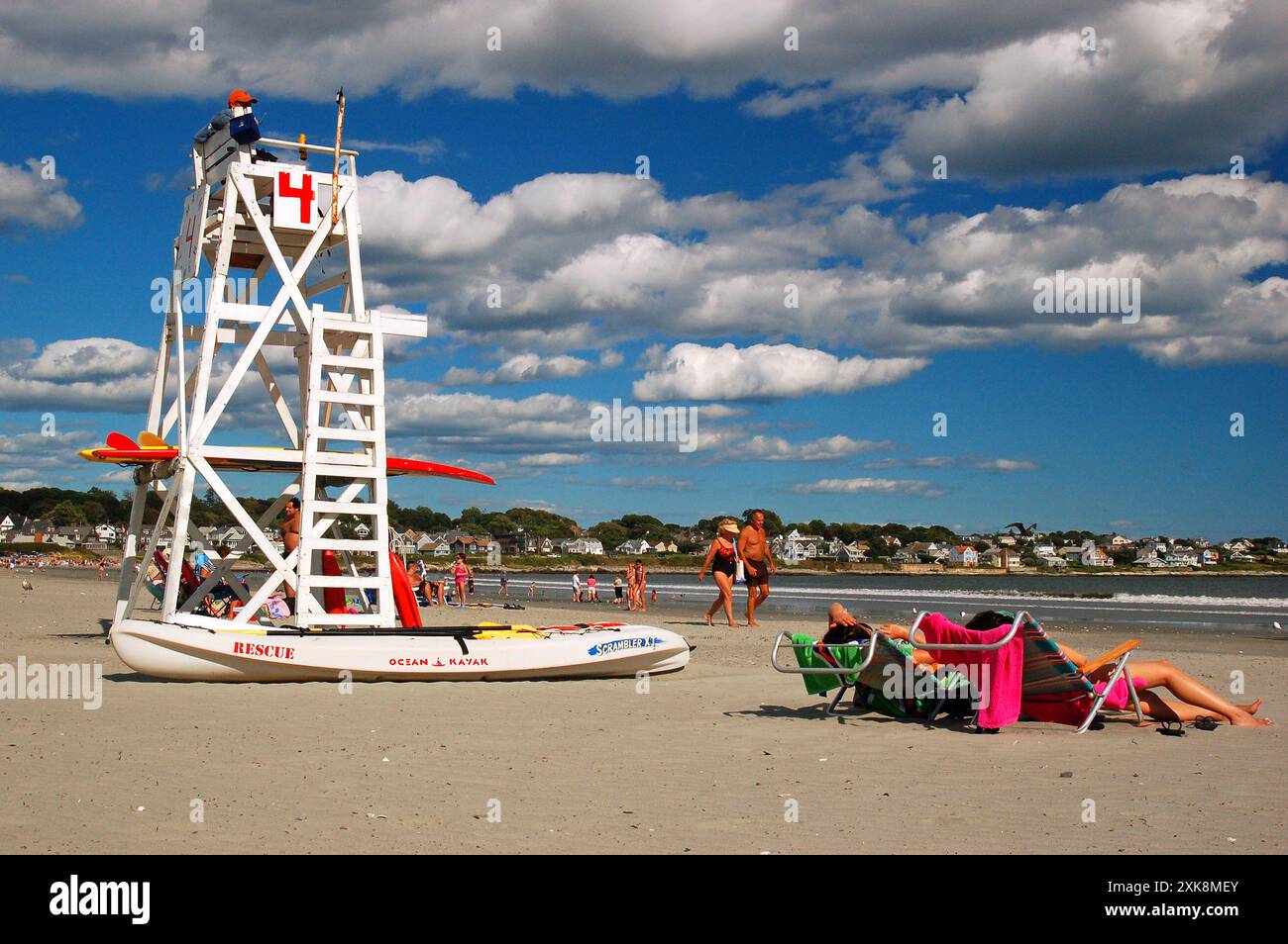 A crowd enjoys a sunny summer’s day at the beach in Newport, Rhode ...