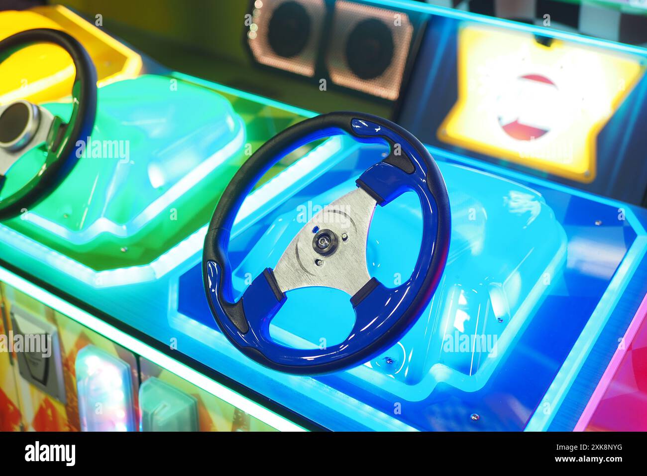 A closeup view of a illuminated steering wheel from an arcade racing ...