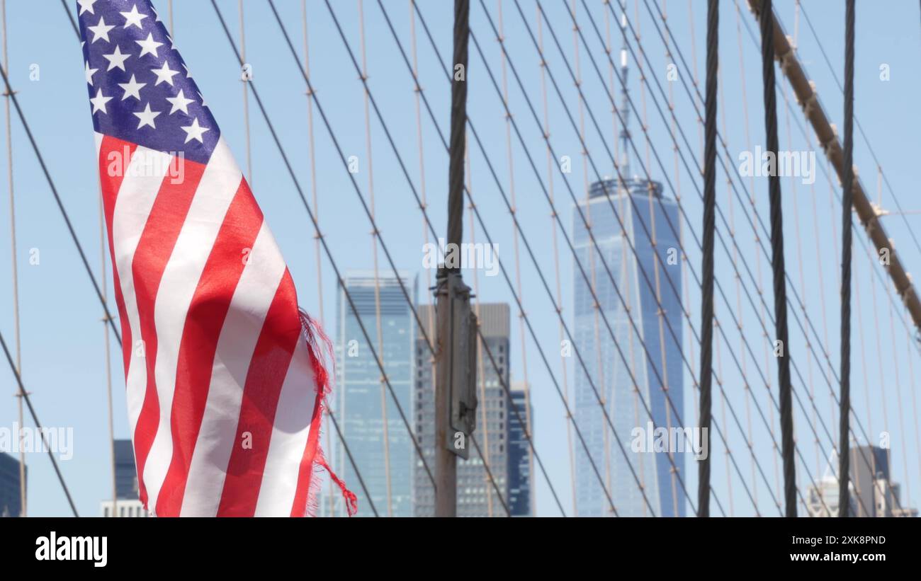 Flag on Brooklyn Bridge, Manhattan downtown, New York City skyline ...
