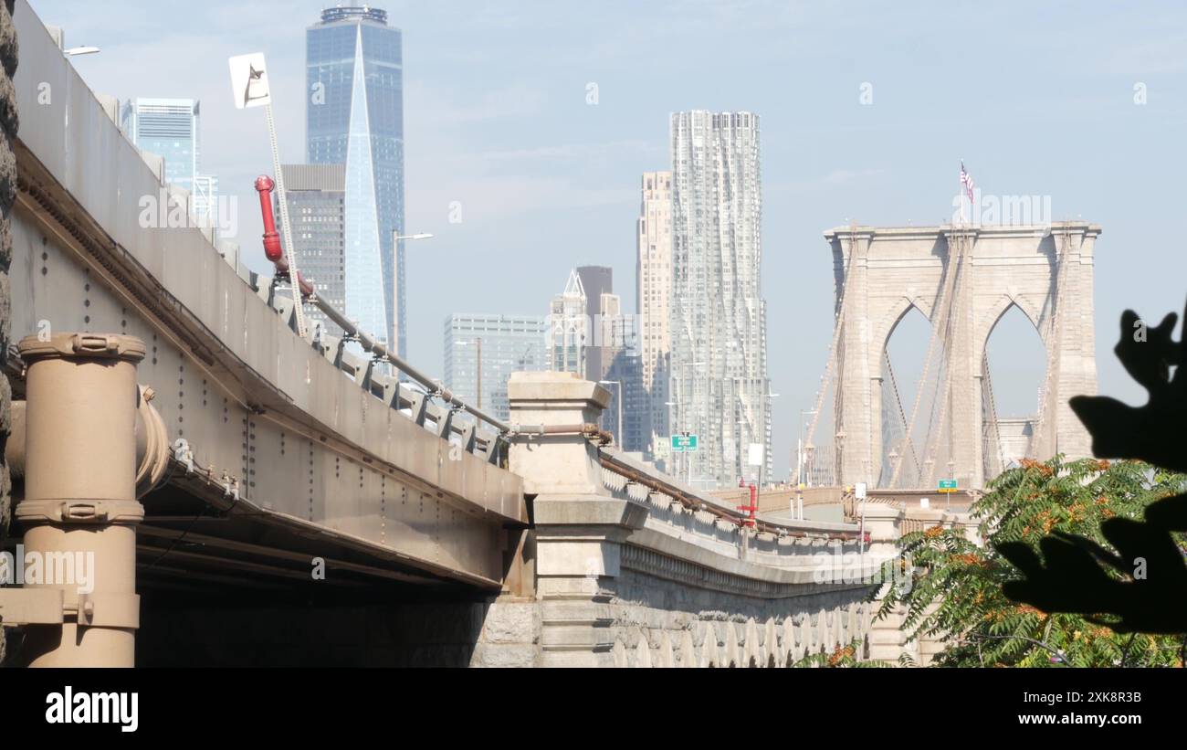 Brooklyn Bridge to Manhattan downtown. New York City skyline, financial ...