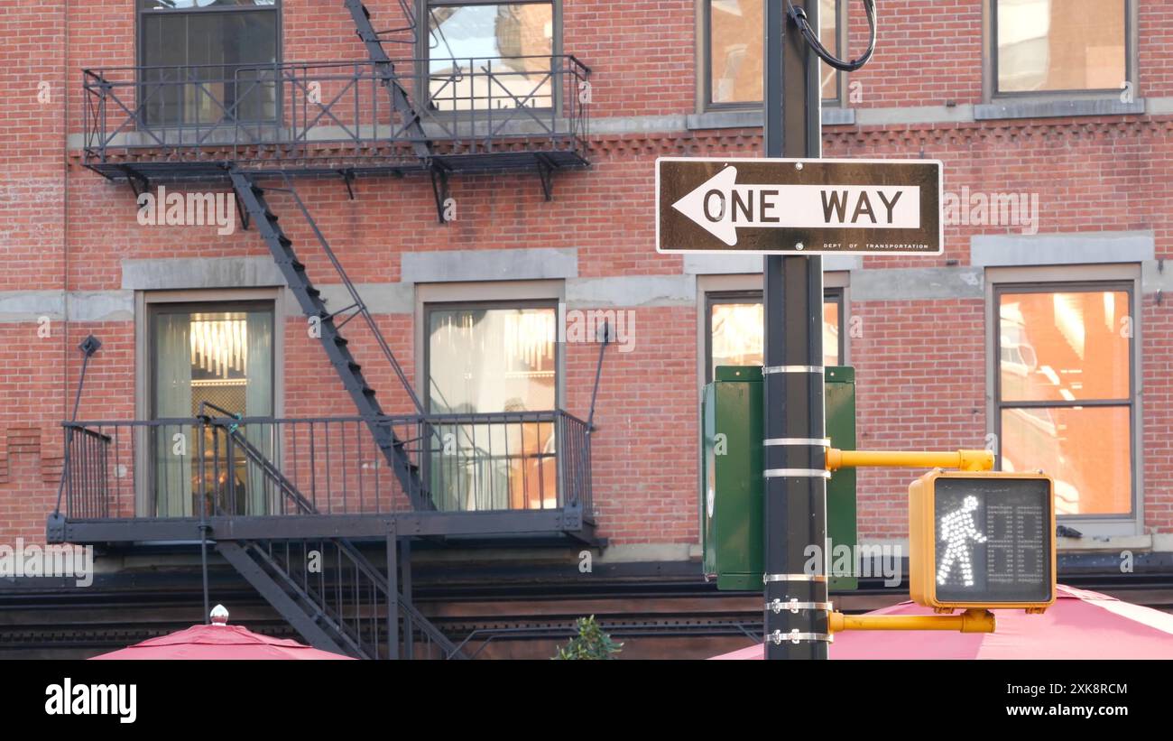 New York City street crossroad, yellow traffic light, oneway transport ...