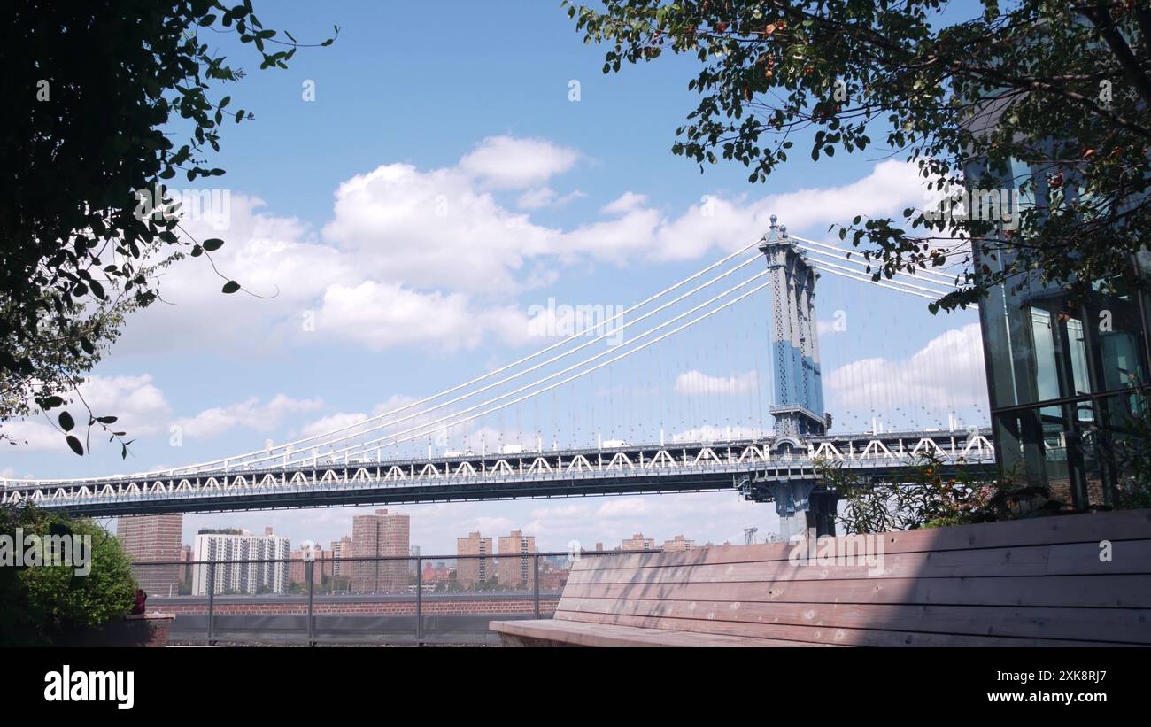 New York City Manhattan Bridge to Brooklyn Dumbo. Bench on waterfront ...
