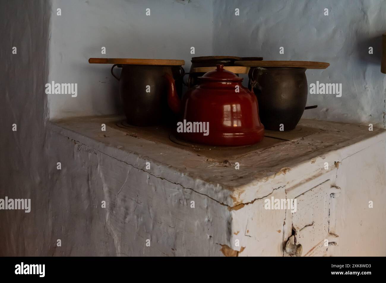 Old clay pots on historic firewood stove in historic polish cottage ...