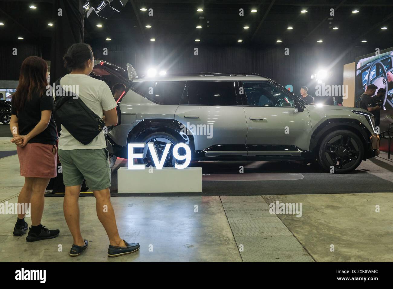 Setia Alam, Malaysia. 21st July, 2024. Visitors seen observing by the new KIA EV9 car at EvX ...