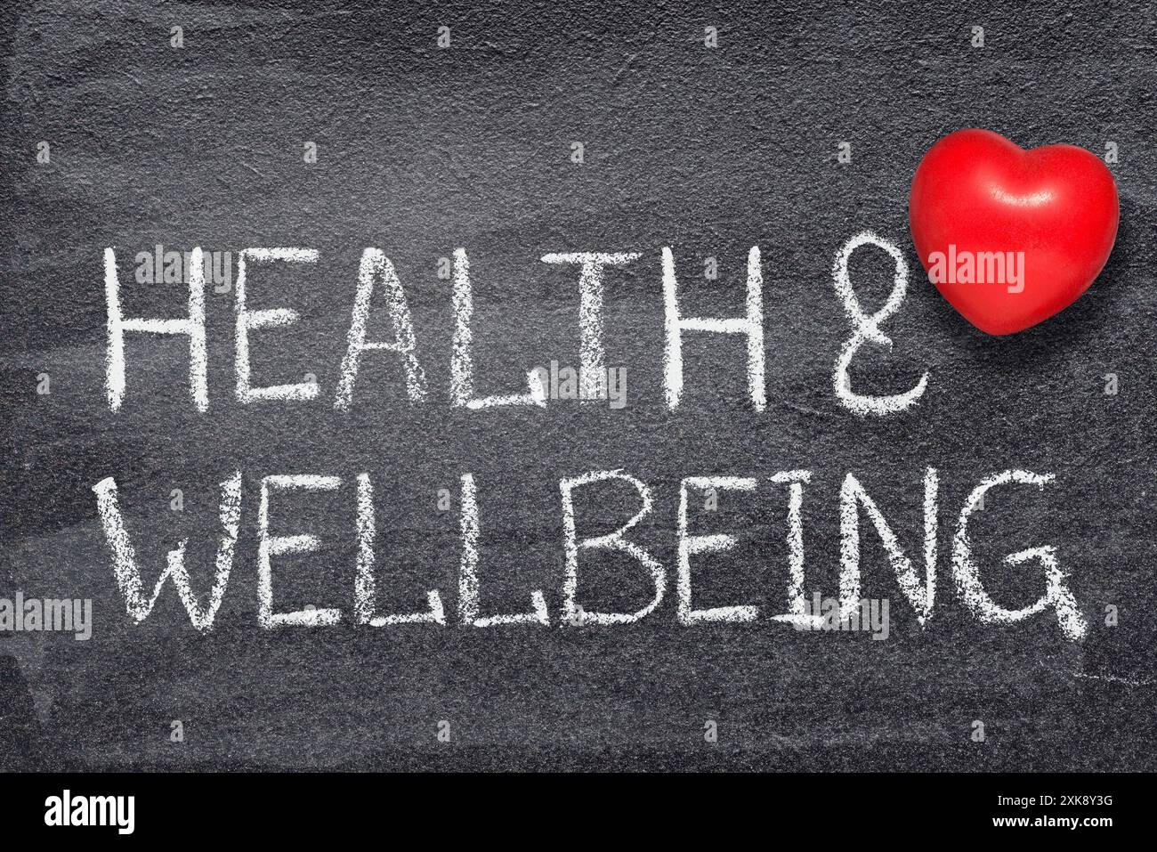health and wellbeng phrase written on chalkboard with red heart symbol ...
