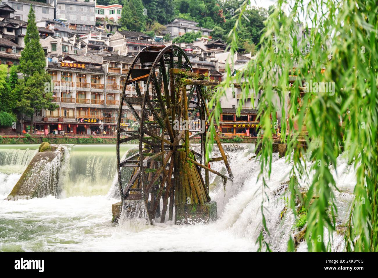 Amazing view of water wheel and waterfall, Phoenix Ancient Town Stock ...