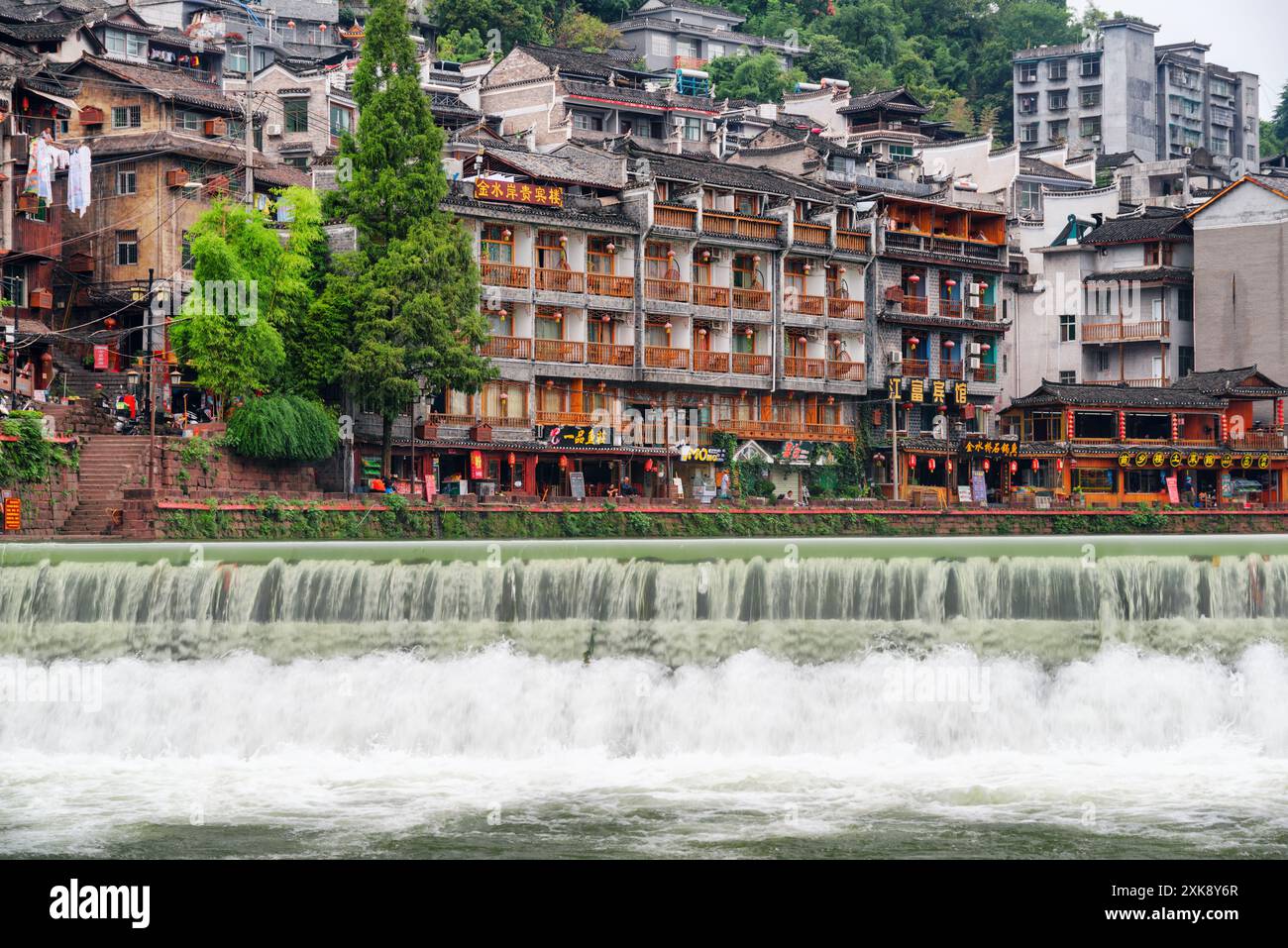 Scenic waterfall on the Tuojiang River in Phoenix Ancient Town Stock ...
