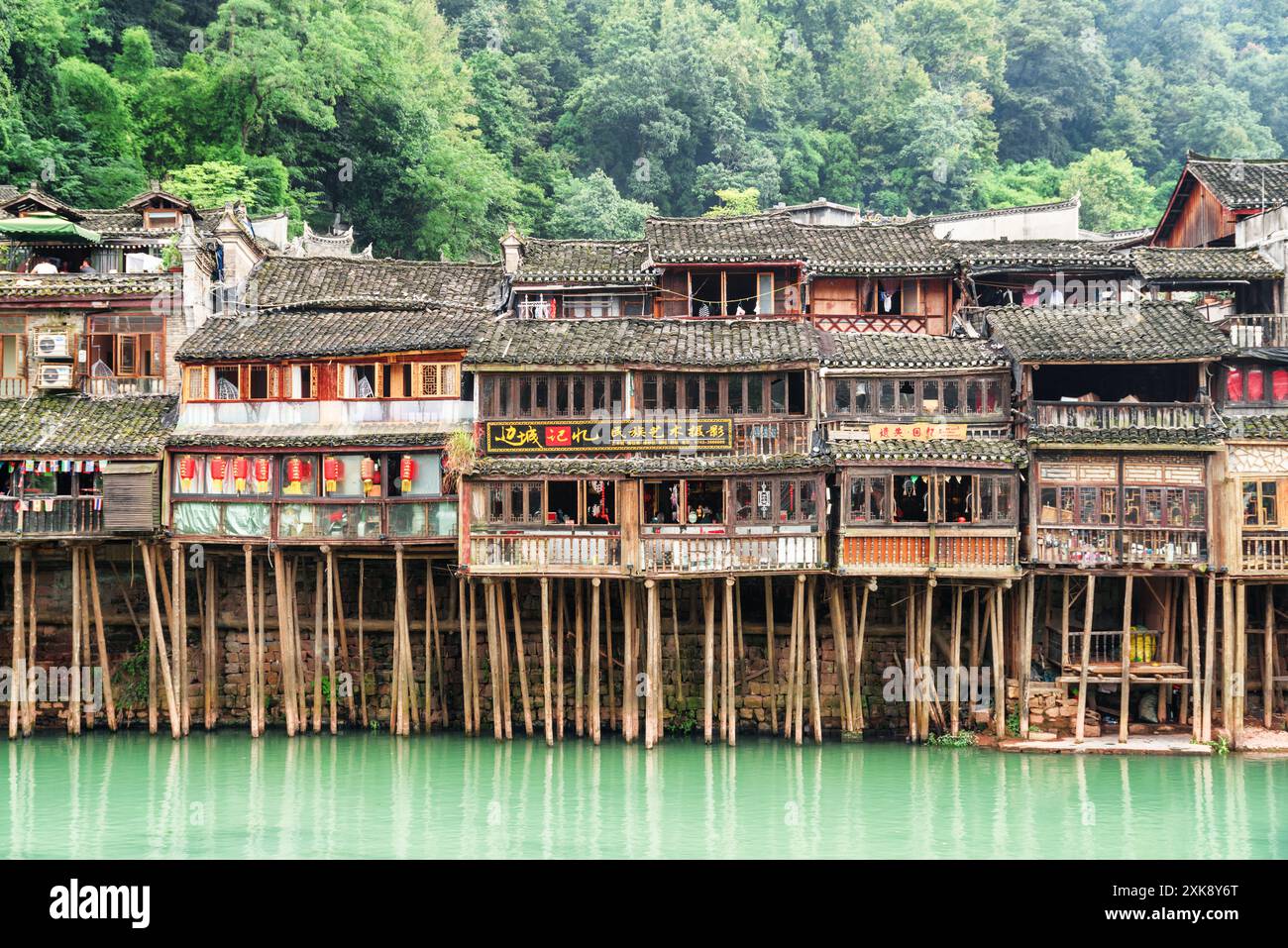 Scenic old authentic Chinese wooden riverside houses on stilts Stock ...