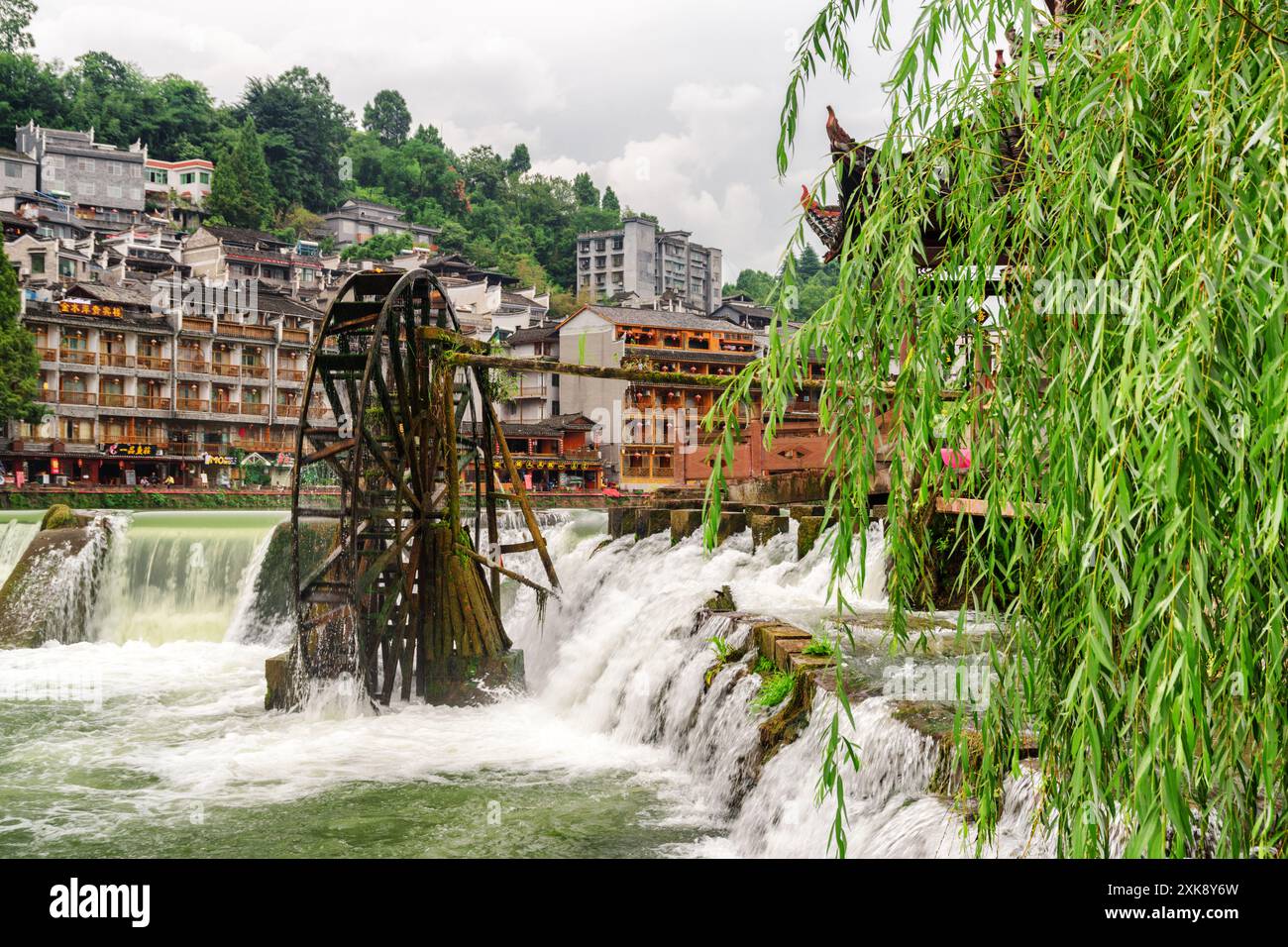 Scenic view of water wheel and waterfall, Phoenix Ancient Town Stock ...