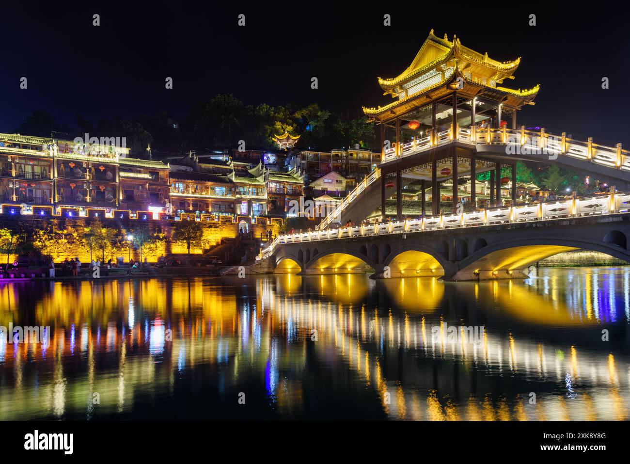 Night view of scenic bridge and Chinese riverside buildings Stock Photo ...