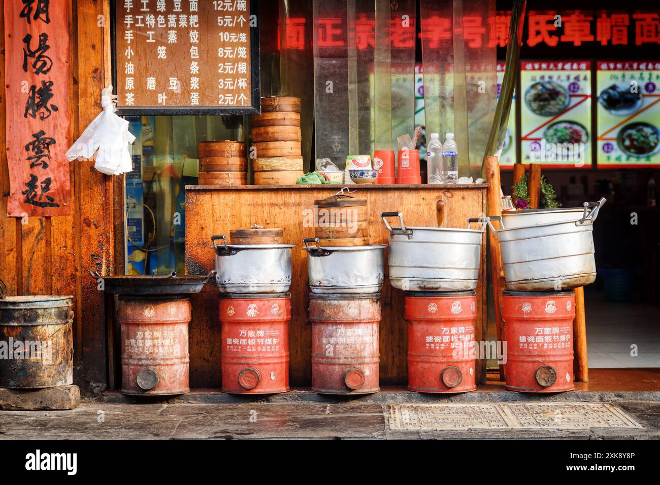 Cooking pots and Dim Sum baskets outside Chinese restaurant Stock Photo ...