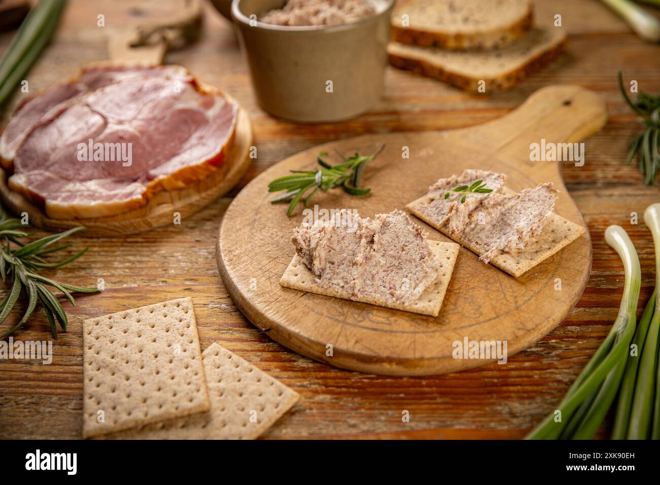 Delicious homemade ham pate on crackers with fresh herbs Stock Photo ...