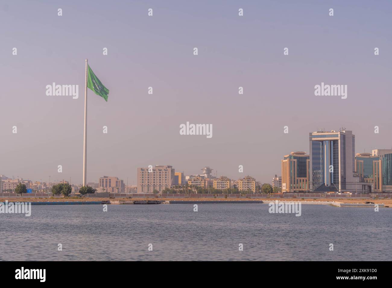 The large Saudi flag in Jeddah, Saudi Arabia, with the city panorama ...