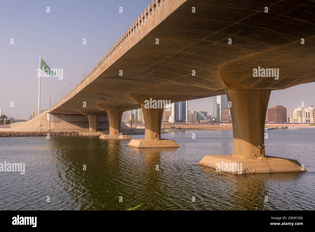 The large Saudi Arabia flag and the bridge across the Jeddah harbor in ...