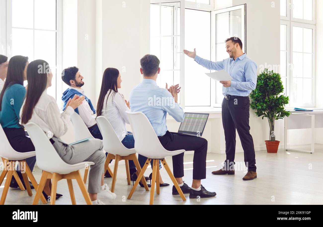 Boss Conducting Work Group Meeting For Office Team Stock Photo - Alamy