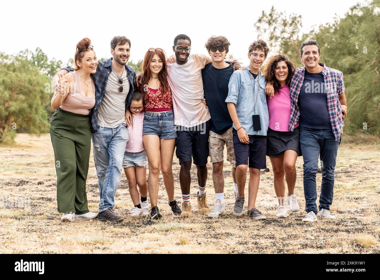 Cheerful diverse group of friends and family members posing together ...