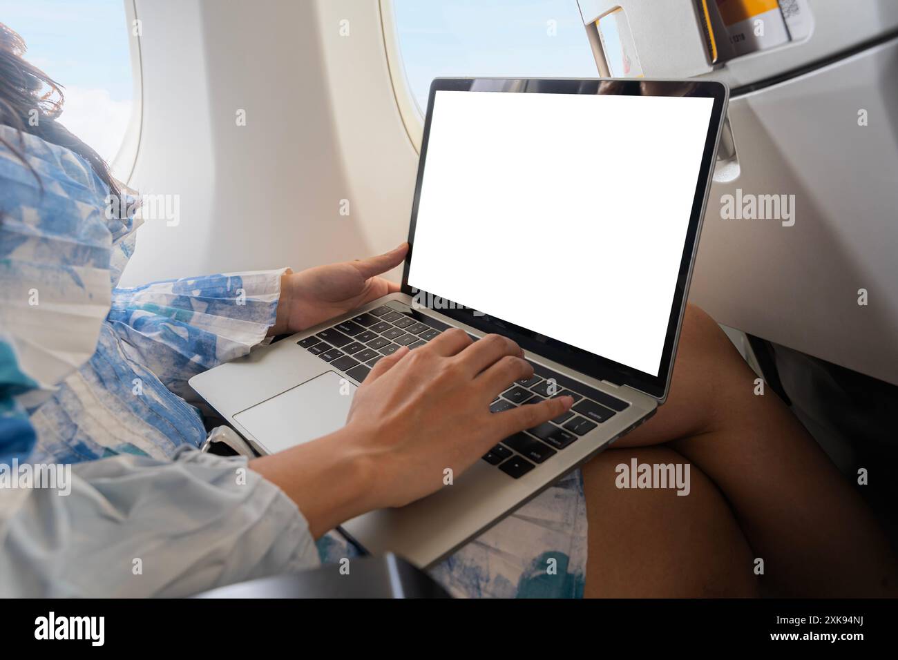 Close up hand of business asian woman uses laptop while flying on ...