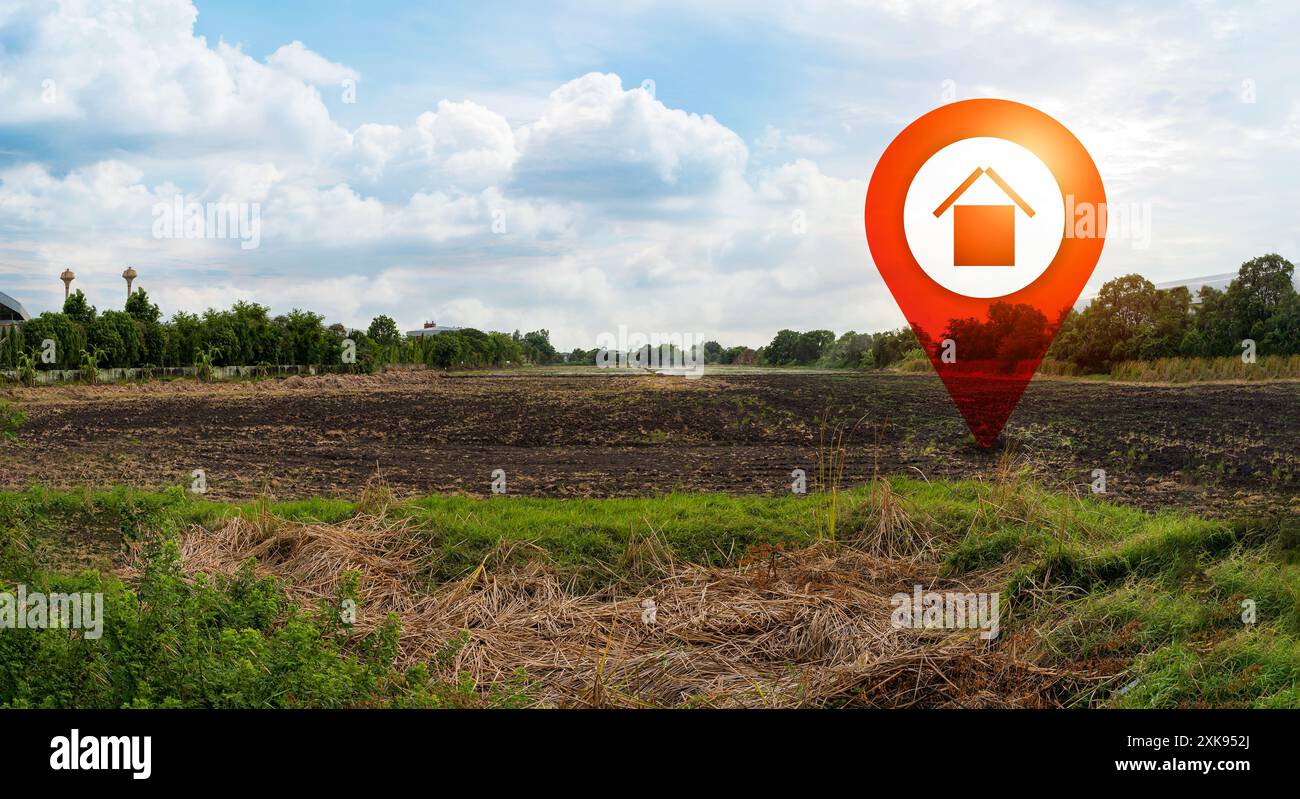 House symbol with location pin icon on empty dry cracked swamp ...