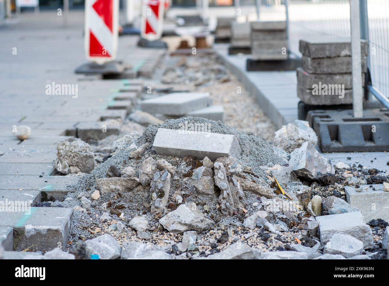 A mountain of rubble and the remains of old paving stones at a ...