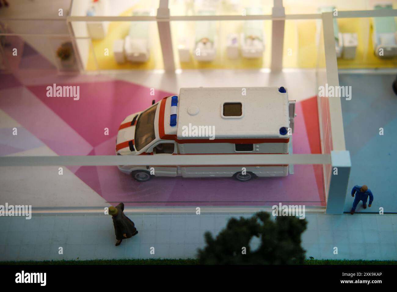 Ambulances outside a hospital entrance in a miniature city scene. Model ...