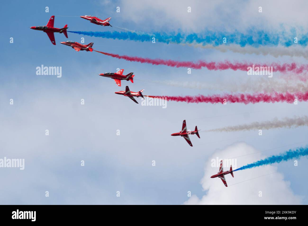 The British Red Arrows perform a split with smoke as part of their ...