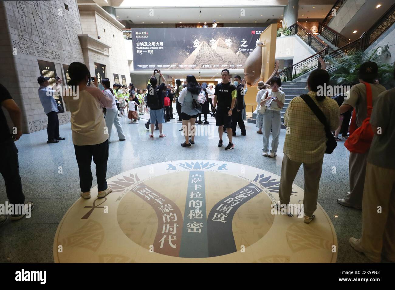 People visit the grand exhibition "On Top of the Pyramid: The ...