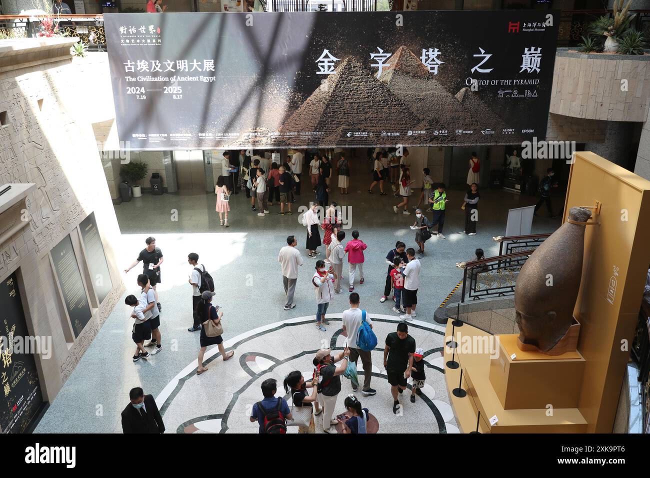 People visit the grand exhibition "On Top of the Pyramid: The ...