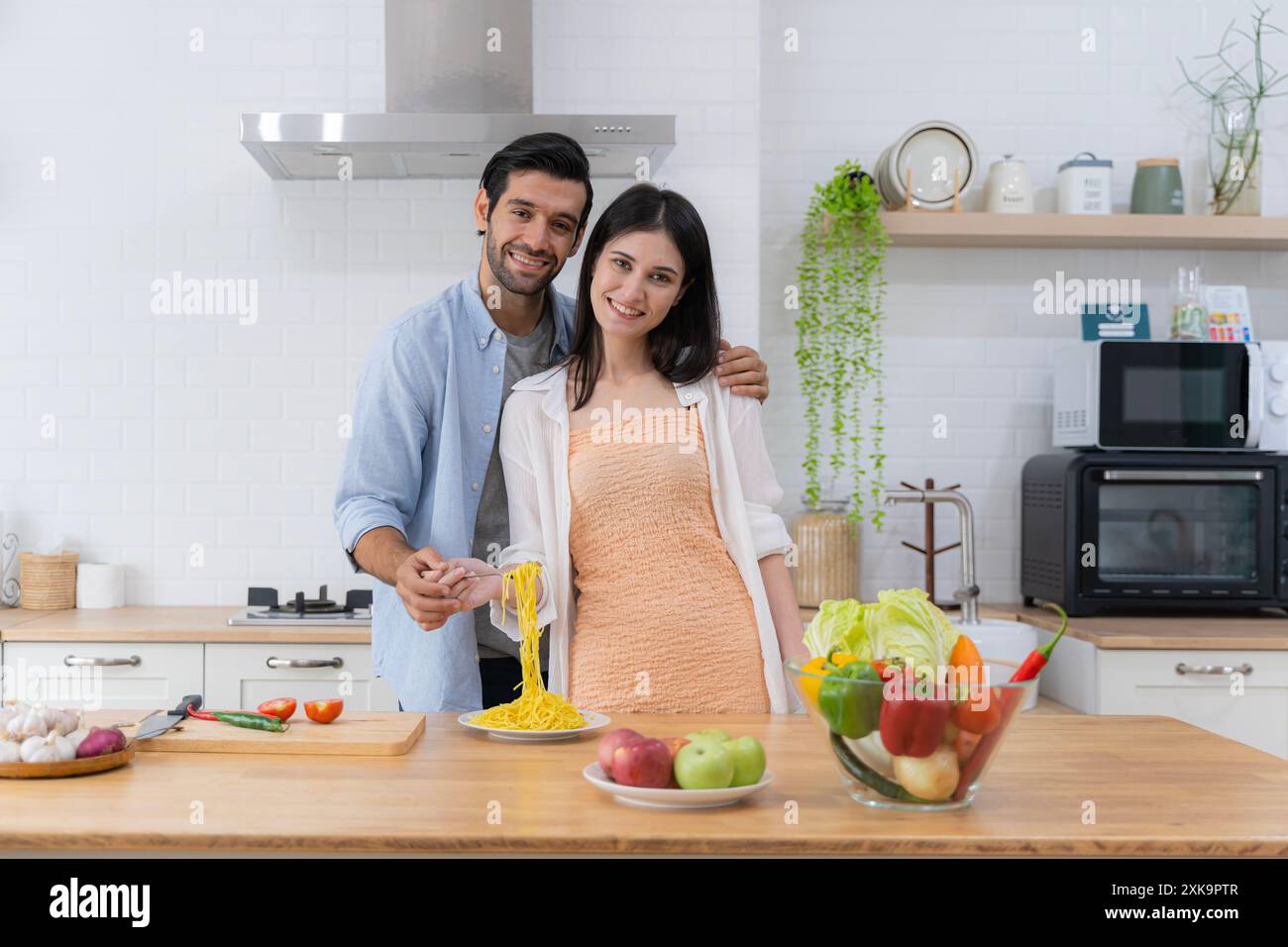 Romantic couple enjoying lunch in the restaurant, eating paste and ...