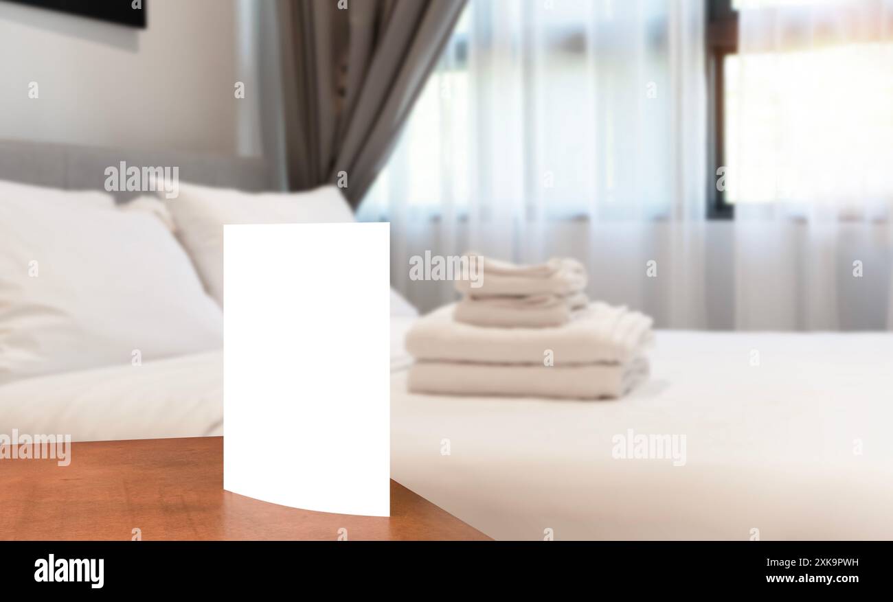 White sign cardboard with copy space on a white round table. Hotel ...