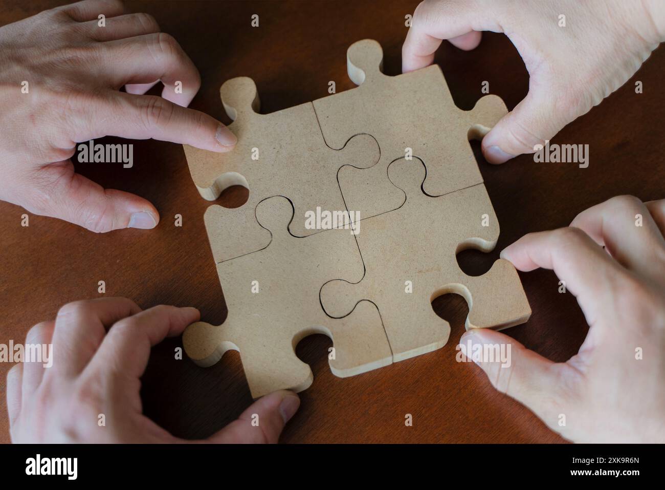 Business teamwork with puzzle finishing project cooperation unity ...
