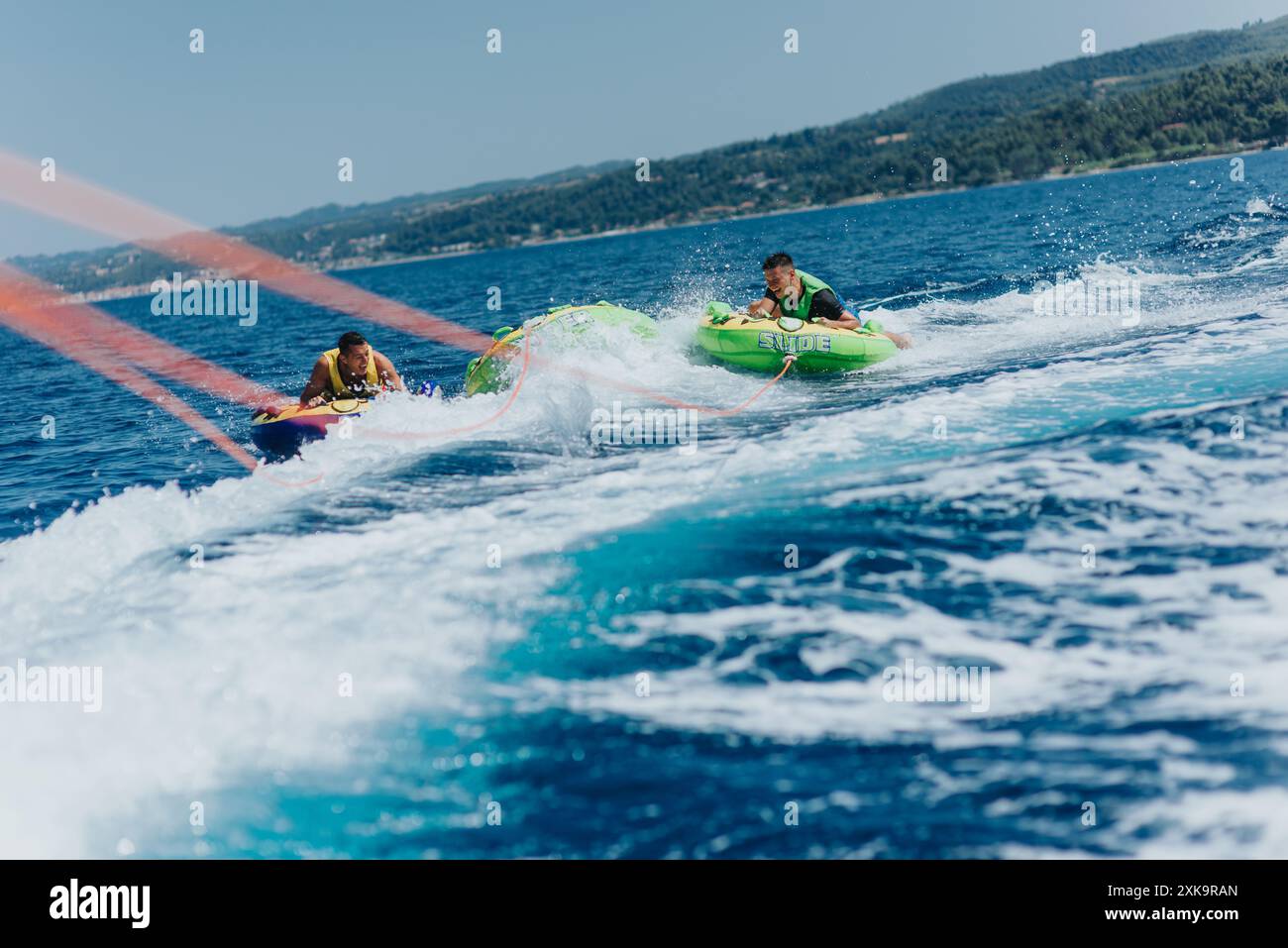 Exciting summer speedboat tubing adventure in the sea with friends ...