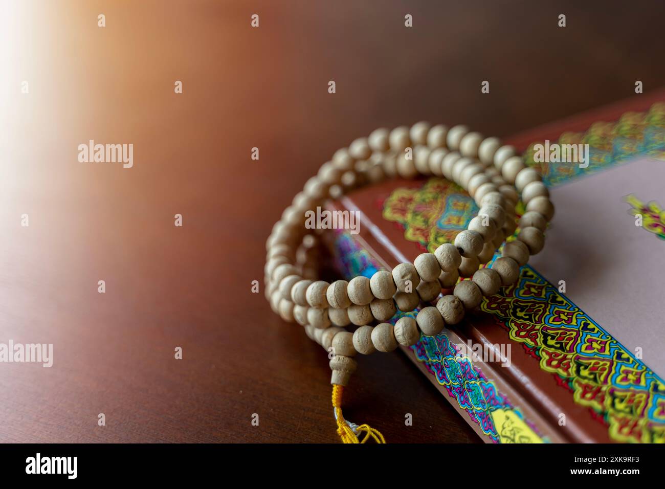Holy Islamic Book Koran with rosary beads on wooden background. Quran ...