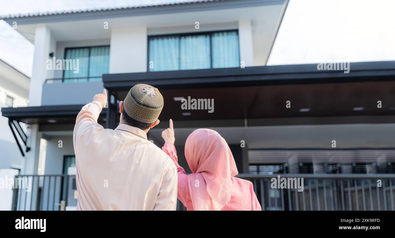Loving young couple looking at dream house. Portrait of an excited ...