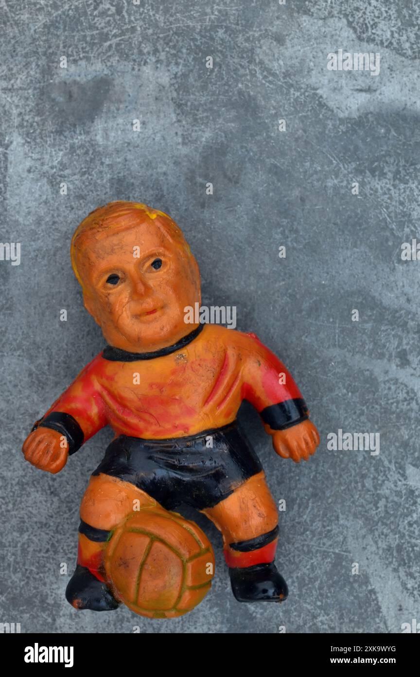 Squat vintage plastic model of European football or soccer player ...