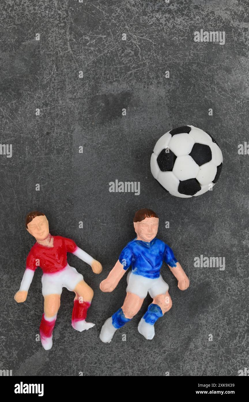 Vintage models of European football or soccer players lined up as if ...