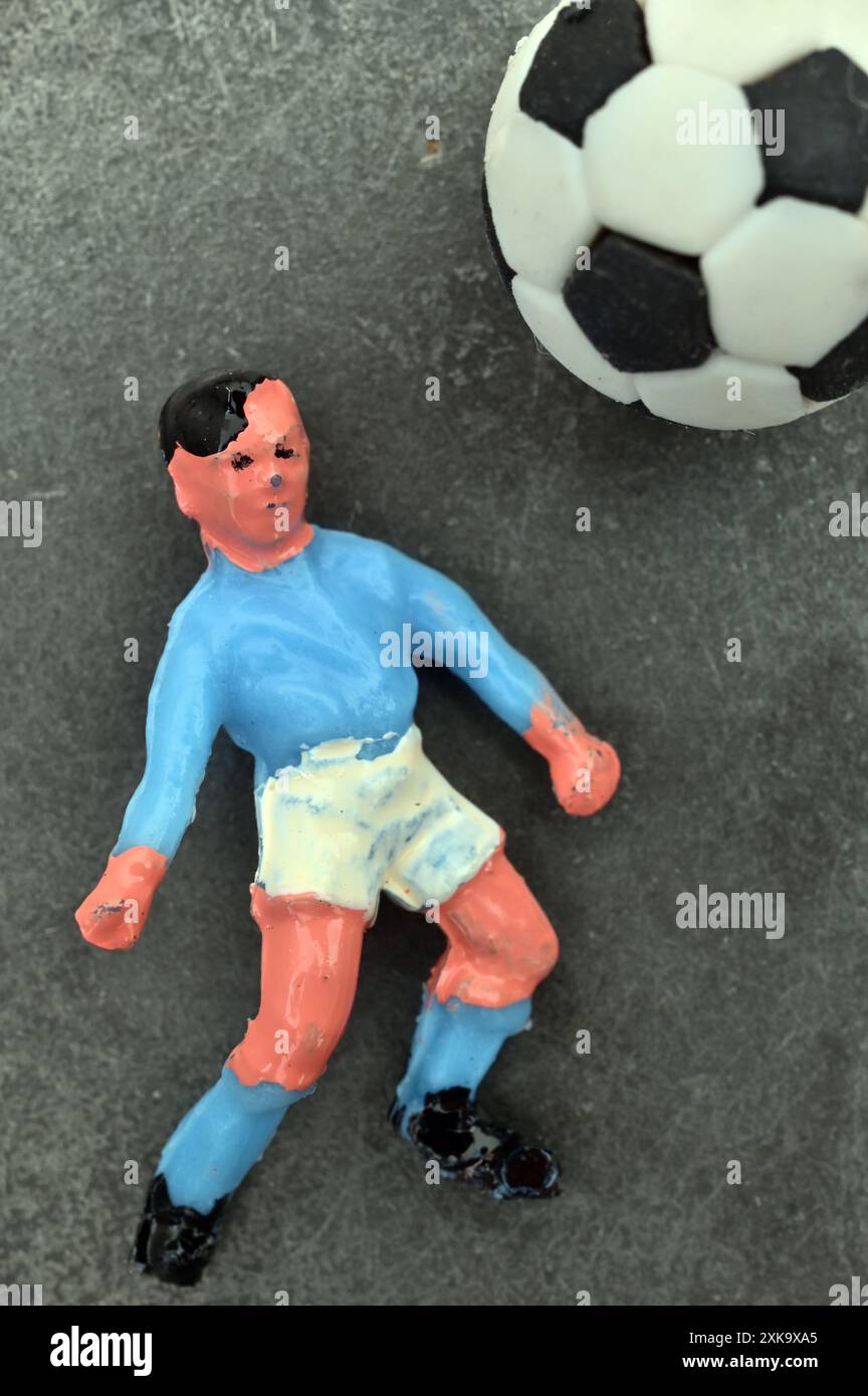 Vintage model of European footballer or soccer player about to receive ...