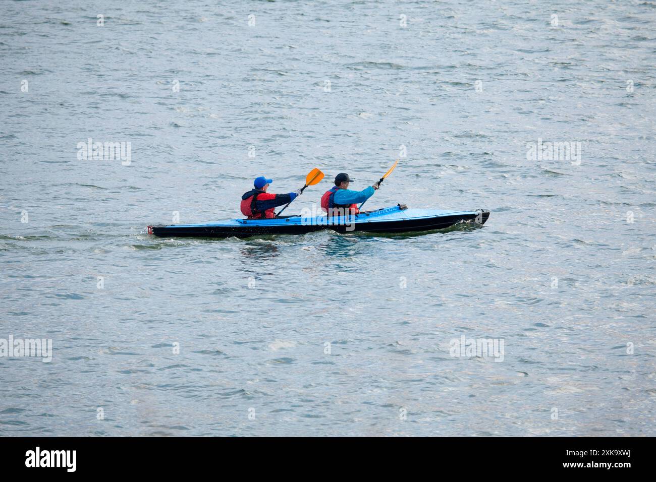 Kayak tandem . Two active people rowing kayak Stock Photo - Alamy