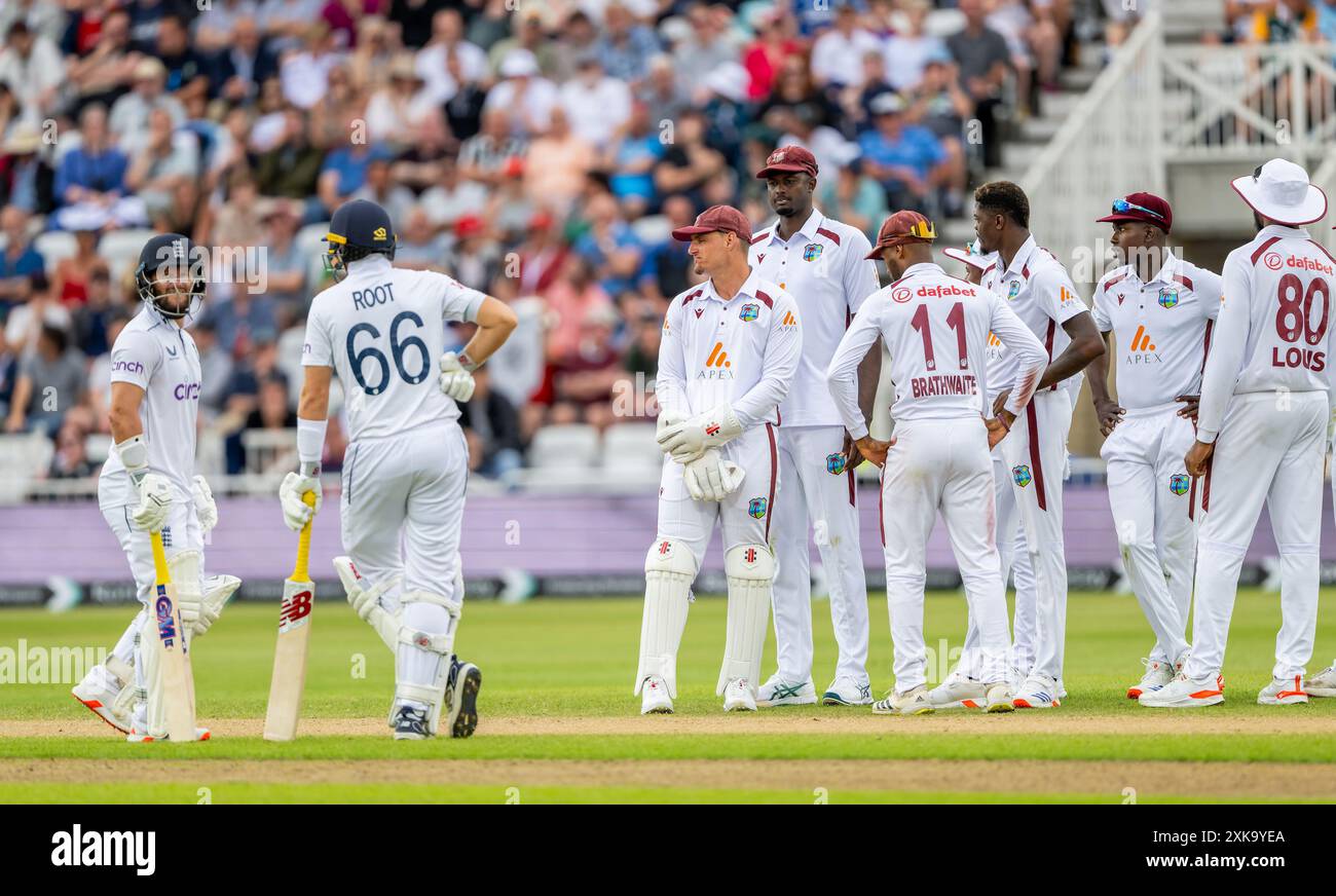 West Indies players wait for a LBW review against Ben Duckett on day ...