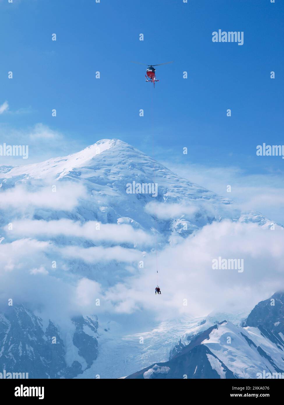 A Rescue Helicopter of the type A star is performing a longline rescue ...