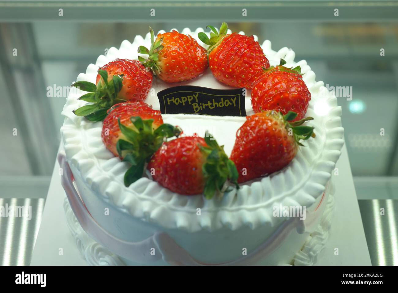 Strawberry-decorated whipped cream cake Stock Photo - Alamy