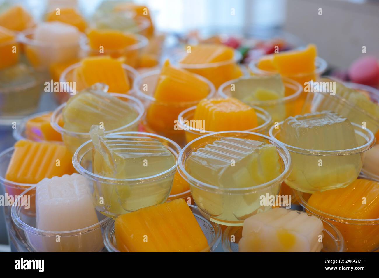 Various colored jellies in plastic cups on buffet Stock Photo - Alamy