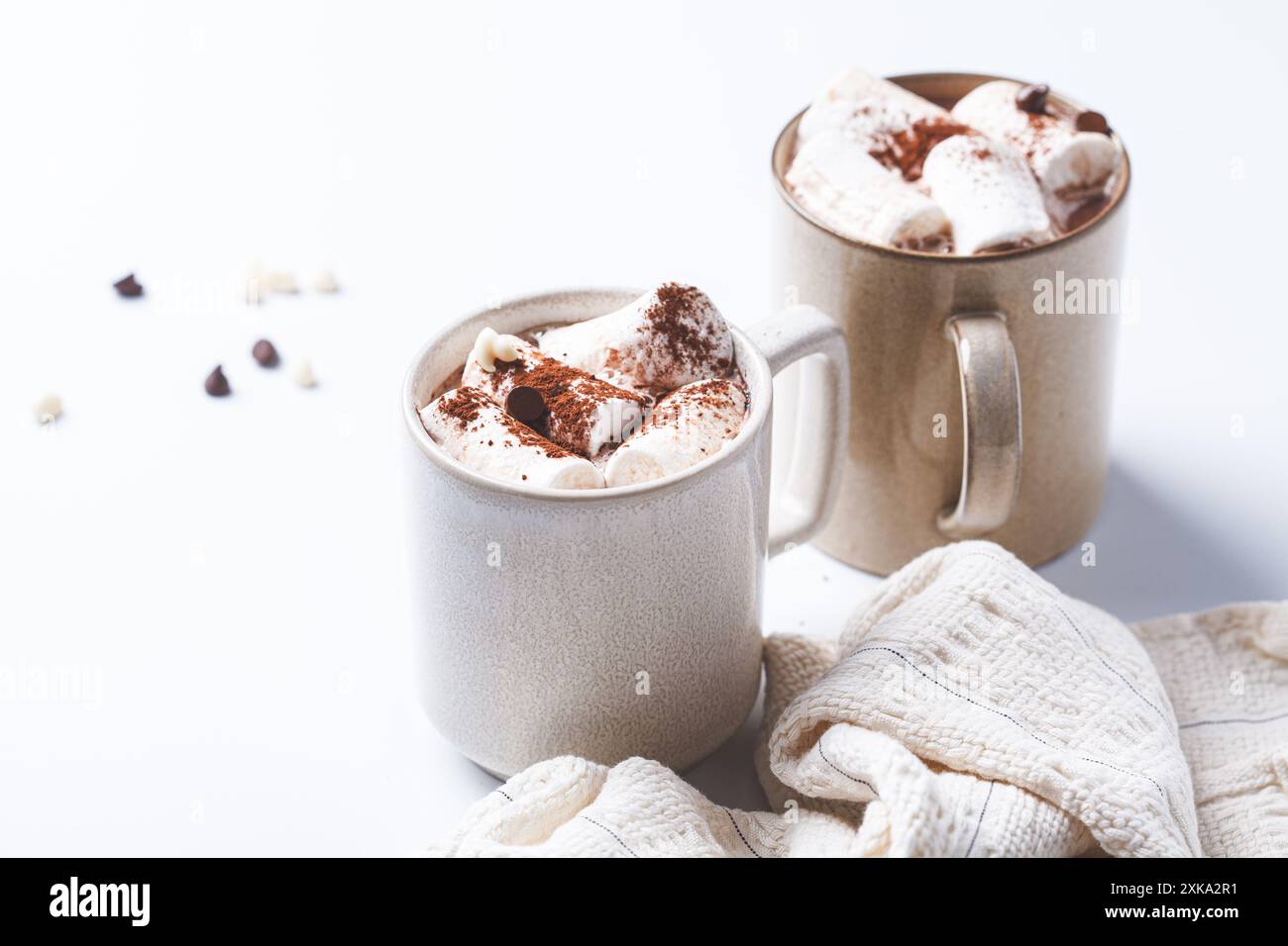 Winter hot cocoa with marshmallows in mug on white background ...