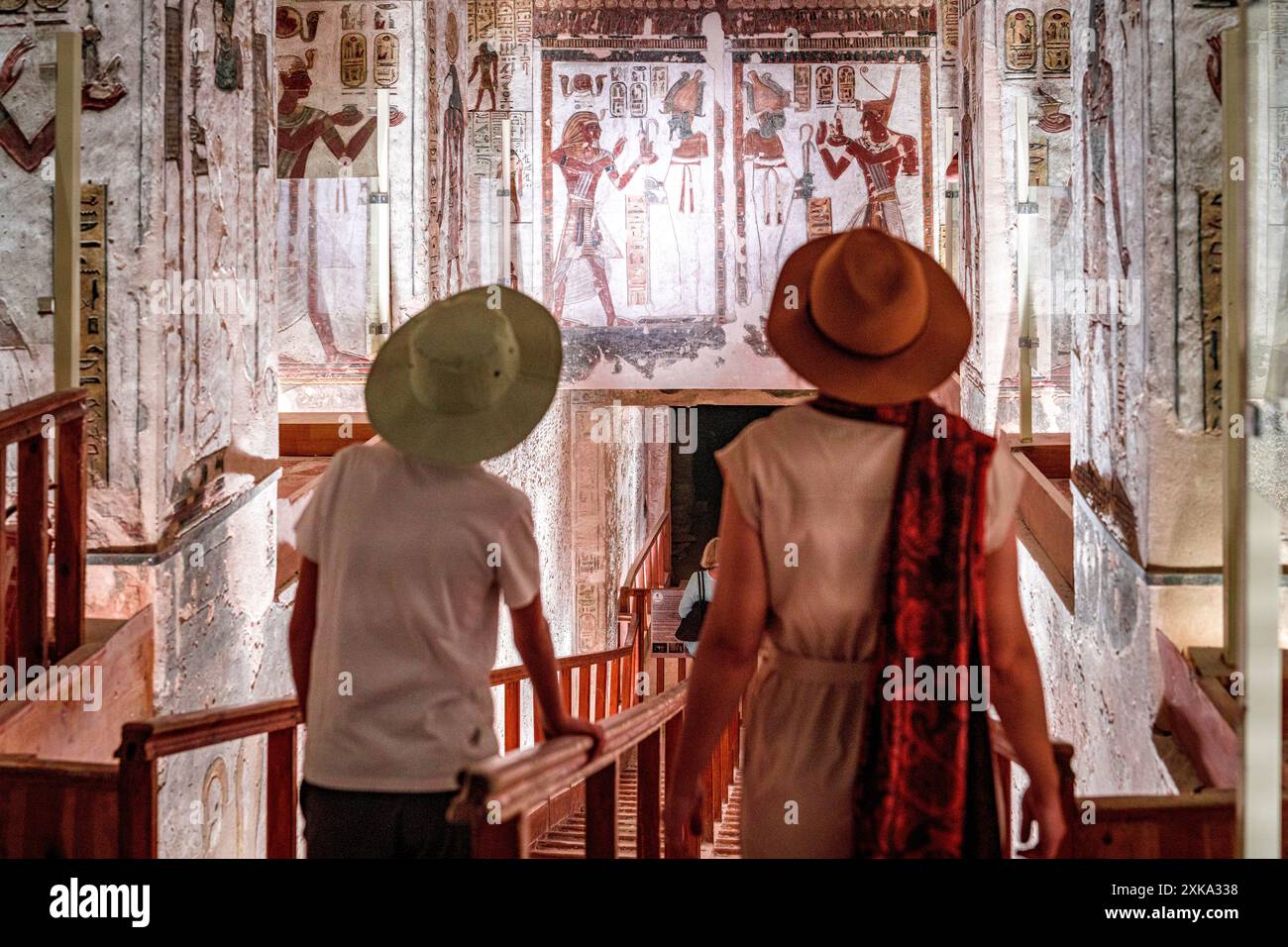 Mother and son exploring Ramses IX Tomb, Valley of the Kings Stock ...