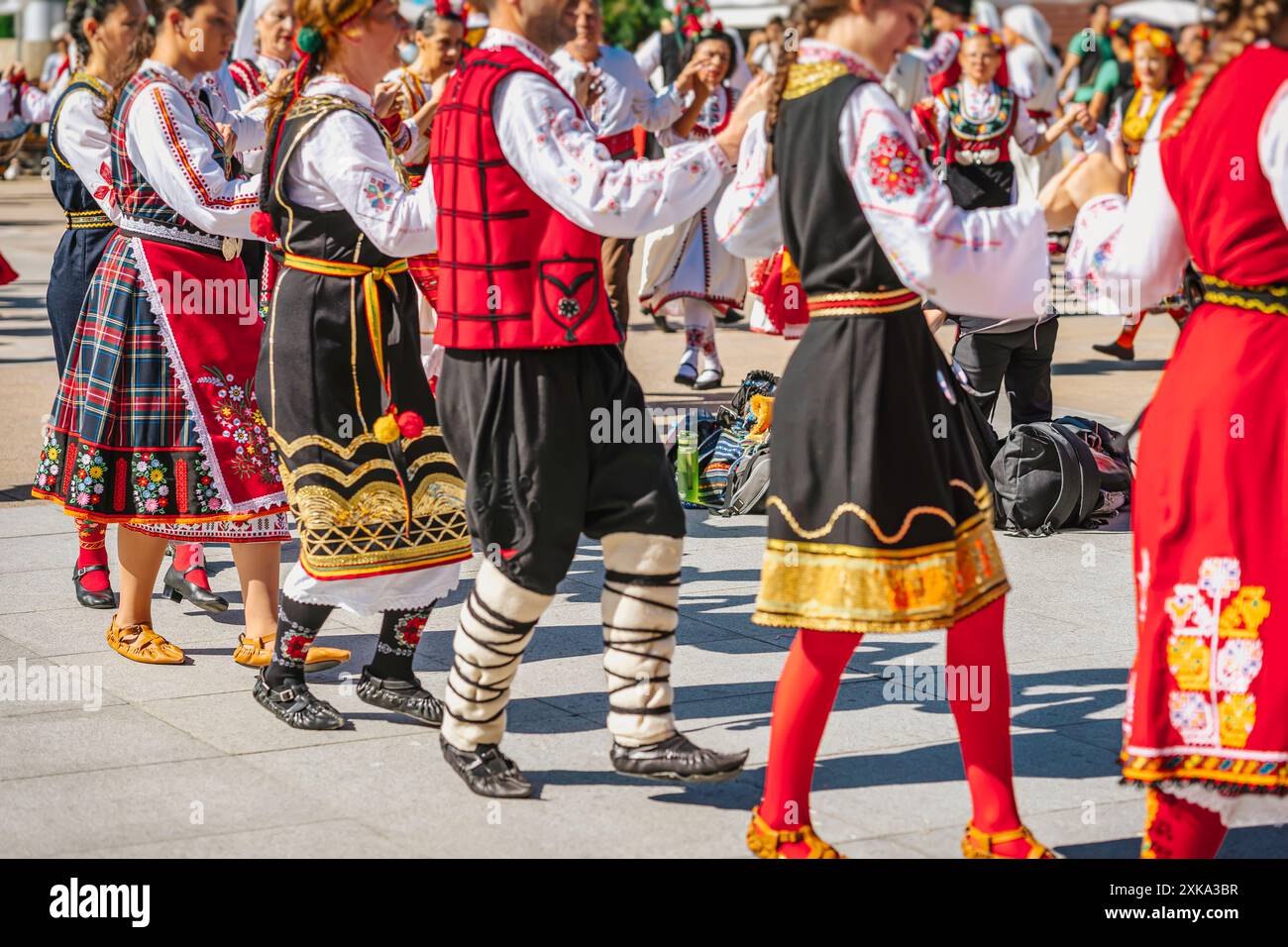 Bulgarian Folk Dancers Performing The Horo In Traditional Dress. Active ...