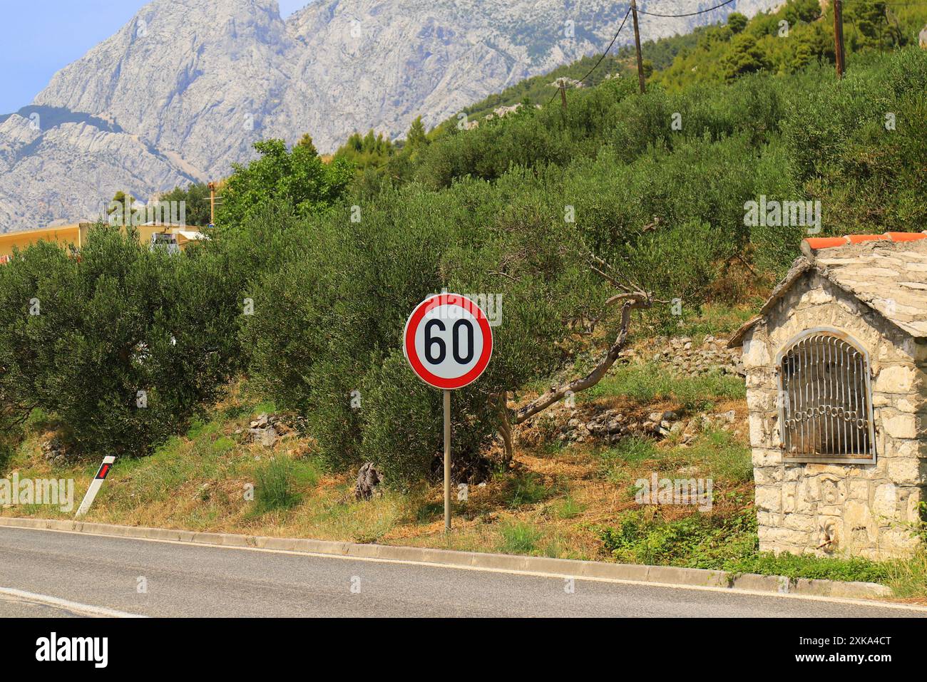Traffic sign 60, Speed limit 60, on mountain road in Croatia, selective ... Traffic sign 60, Speed limit 60, on mountain road in Croatia, selective ...