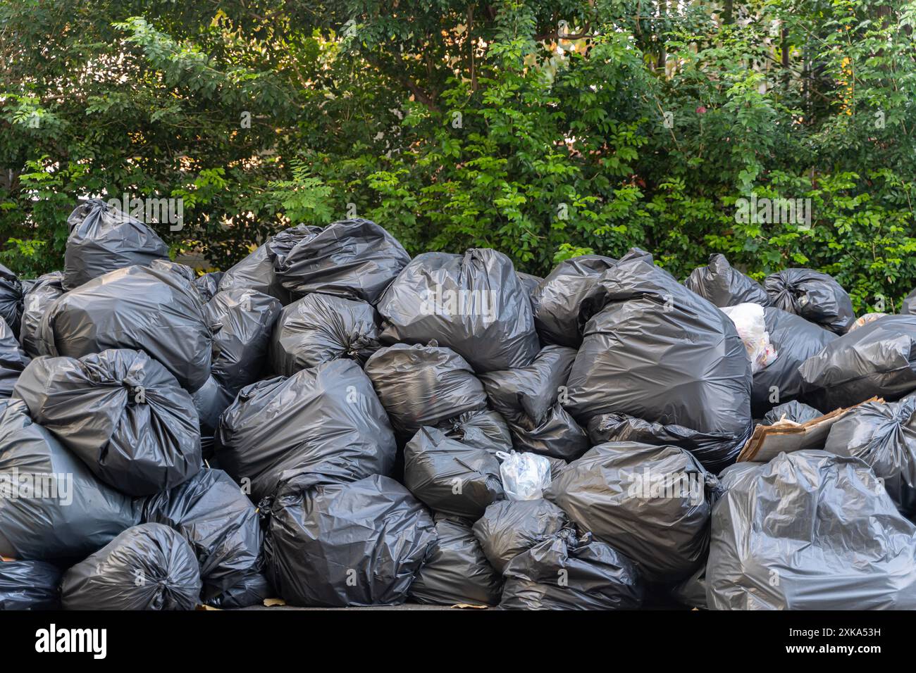 Black trash bag pile up. Wrinkled plastic bags texture pattern. Plenty ...